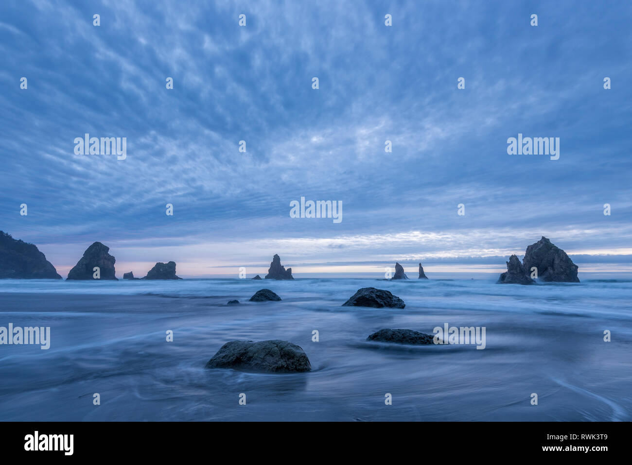 Sea stacks and evening clouds at China Beach, on the Southern Oregon ...