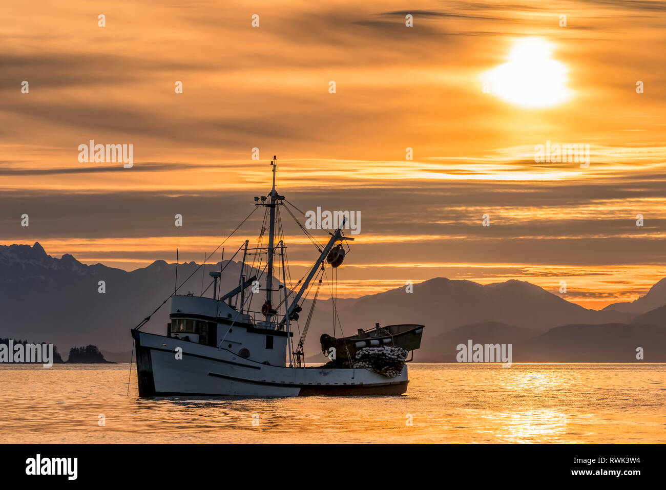 Seiner anchored in Amalga Harbor at sunset awaiting a commercial salmon ...