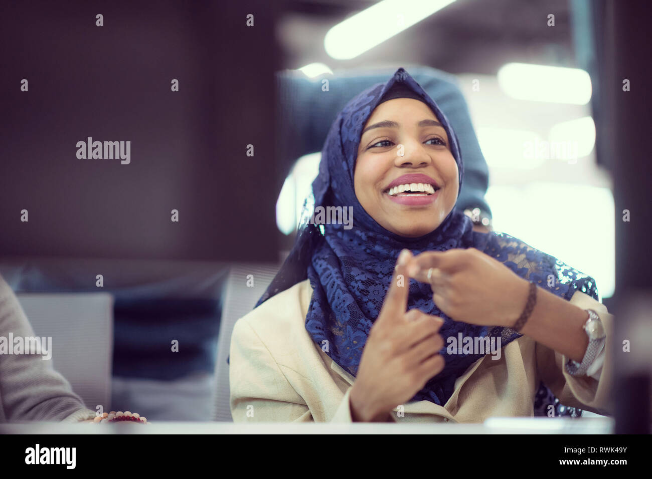 black muslim female software developer working together with her ...