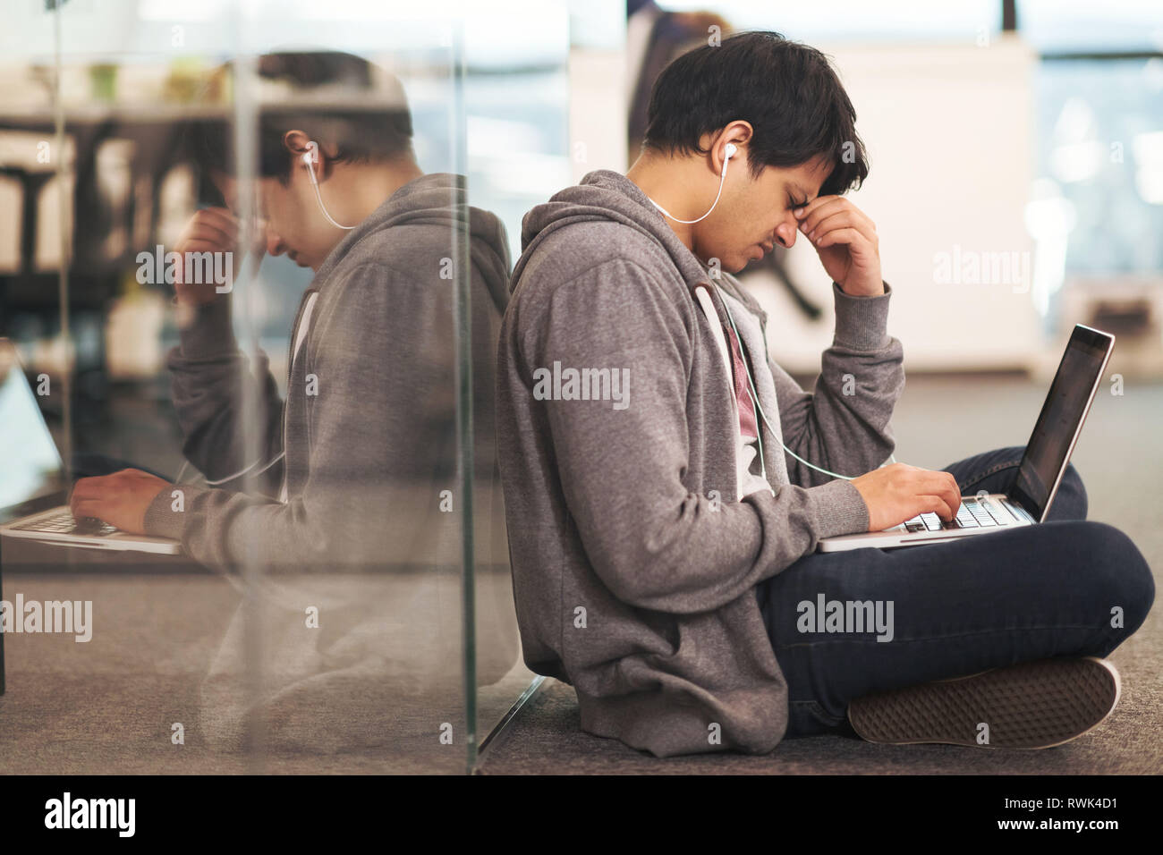 young indian software developer man using laptop computer writing ...