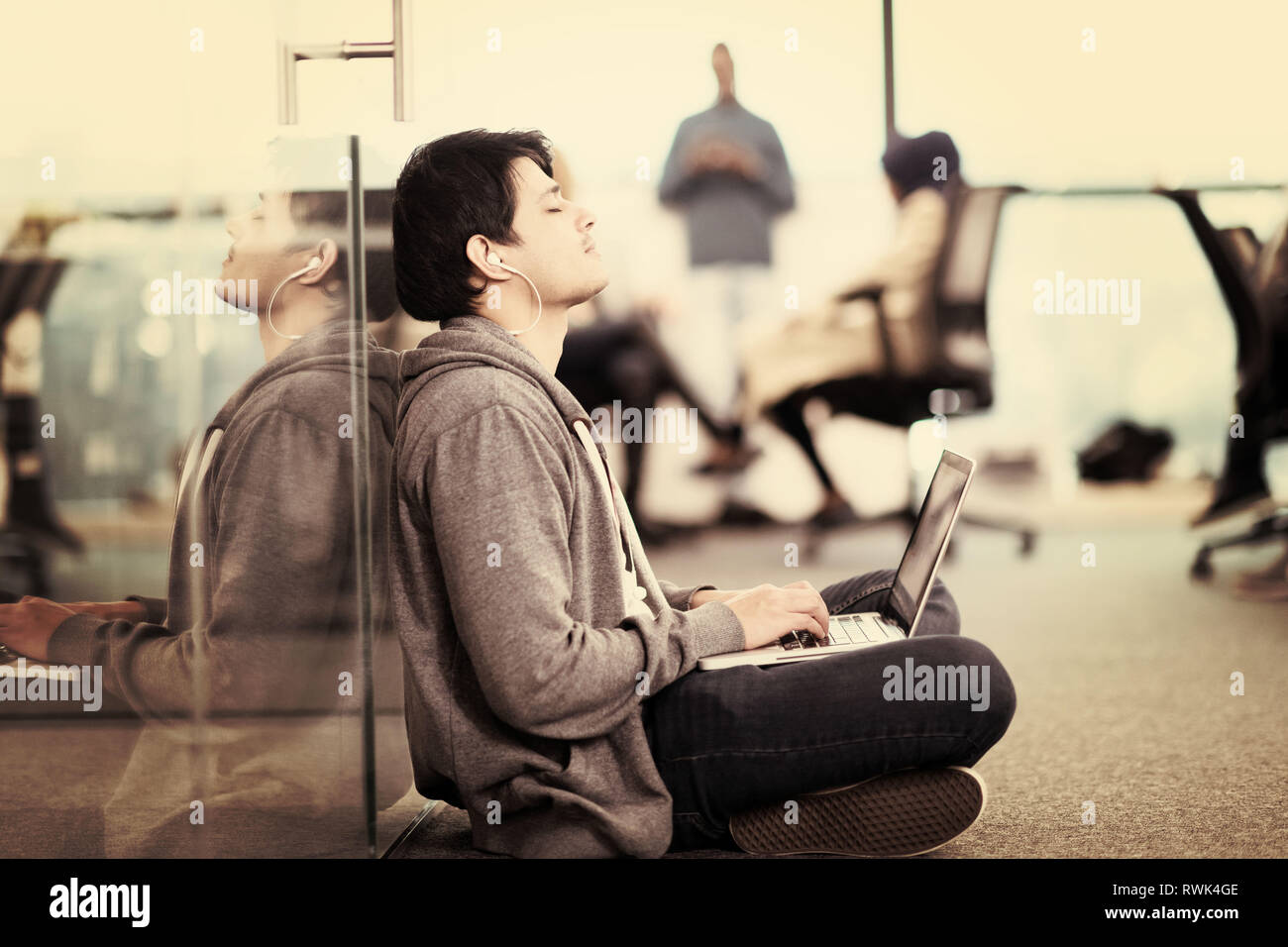 young indian software developer man using laptop computer writing programming code while sitting ...