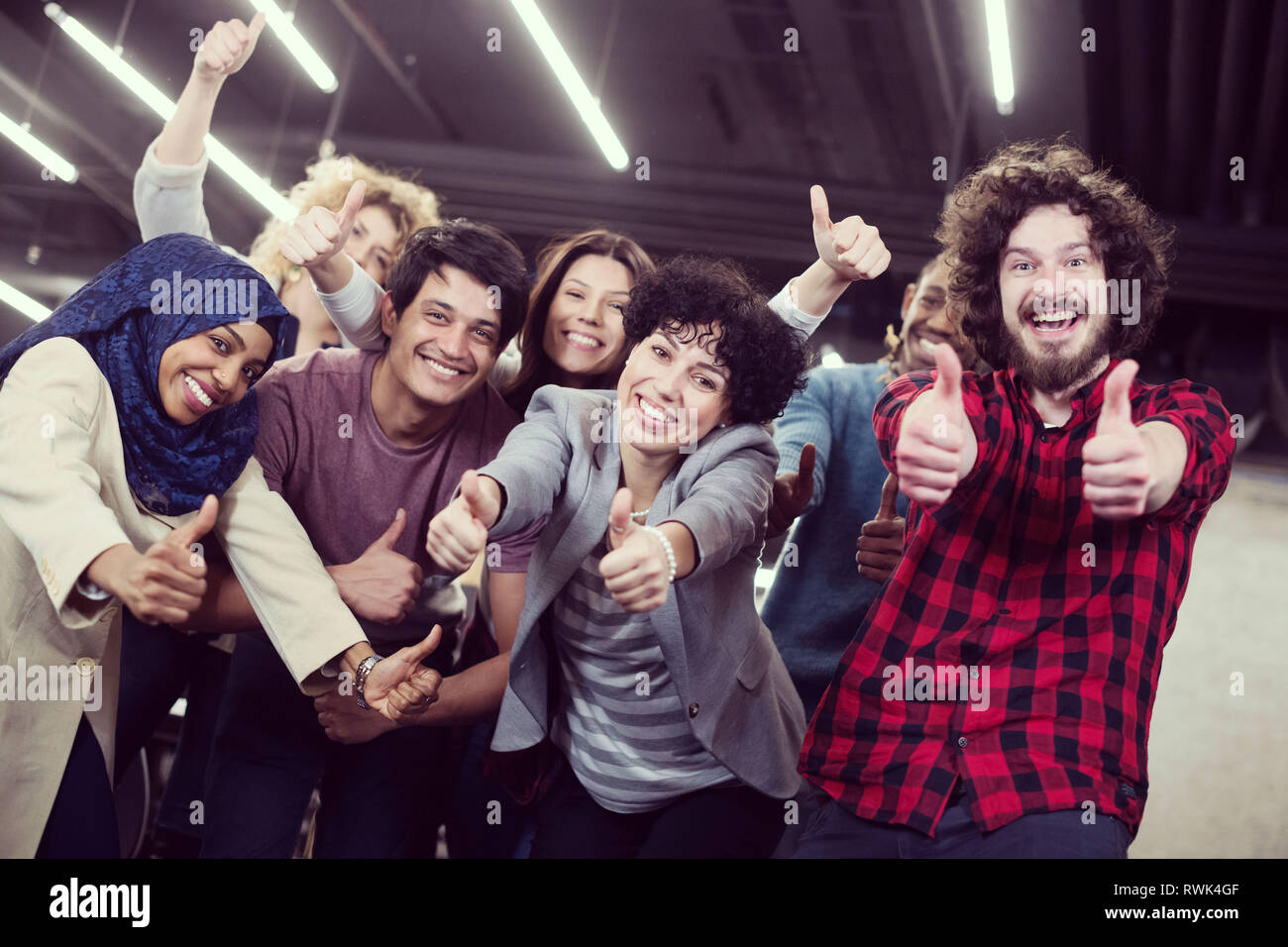portrait of young excited multiethnics business team of software ...