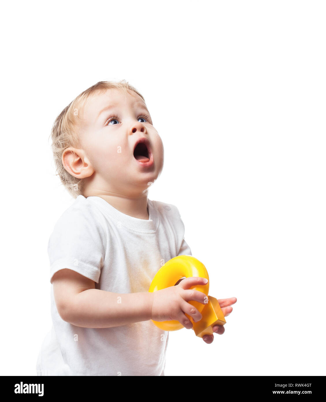 Cute baby boy with surprised expression looking up and to the side ...