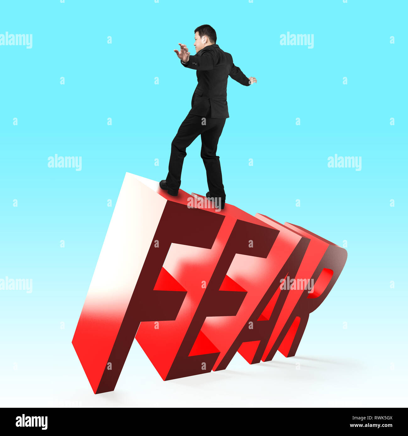 Businessman balancing on 3D red FEAR word falling. Concept of courage ...