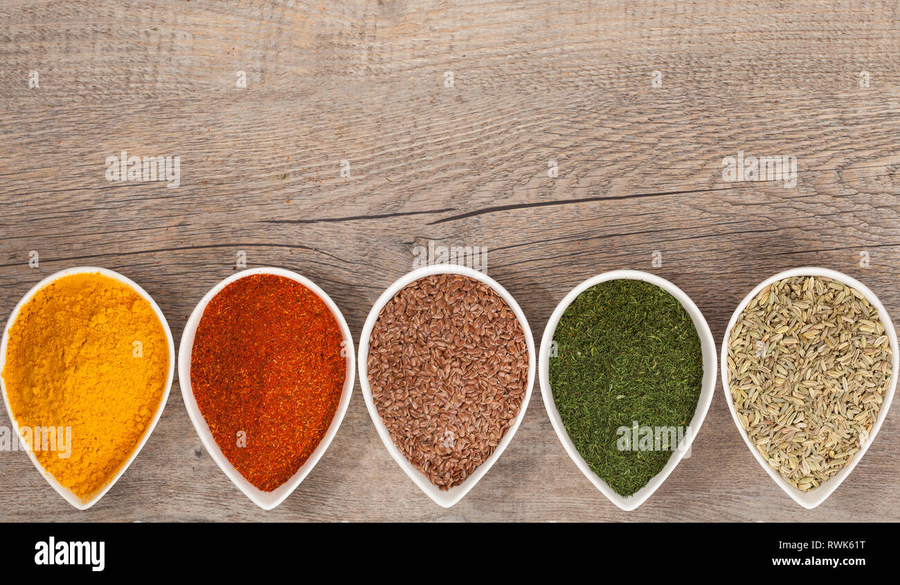 colorful Herbs and Spices in bowls Border Stock Photo - Alamy