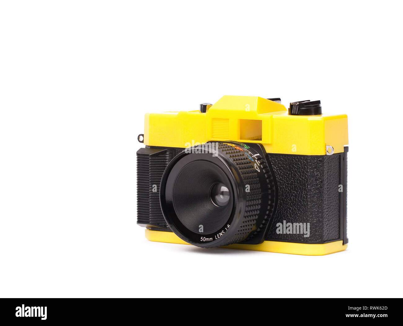 Little yellow plastic toy camera isolated on white Stock Photo - Alamy