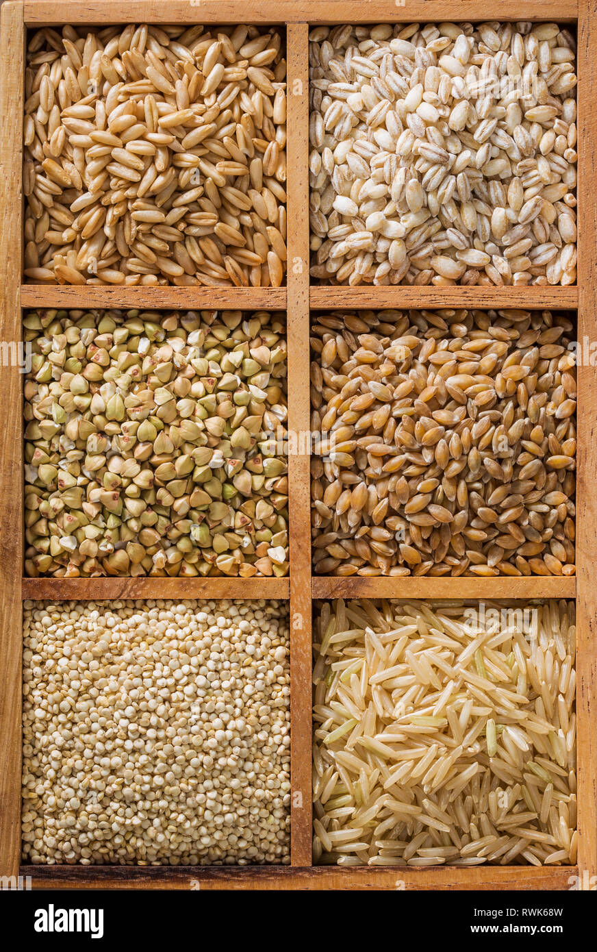 An assortment of healthy whole grains in a wooden box Stock Photo - Alamy