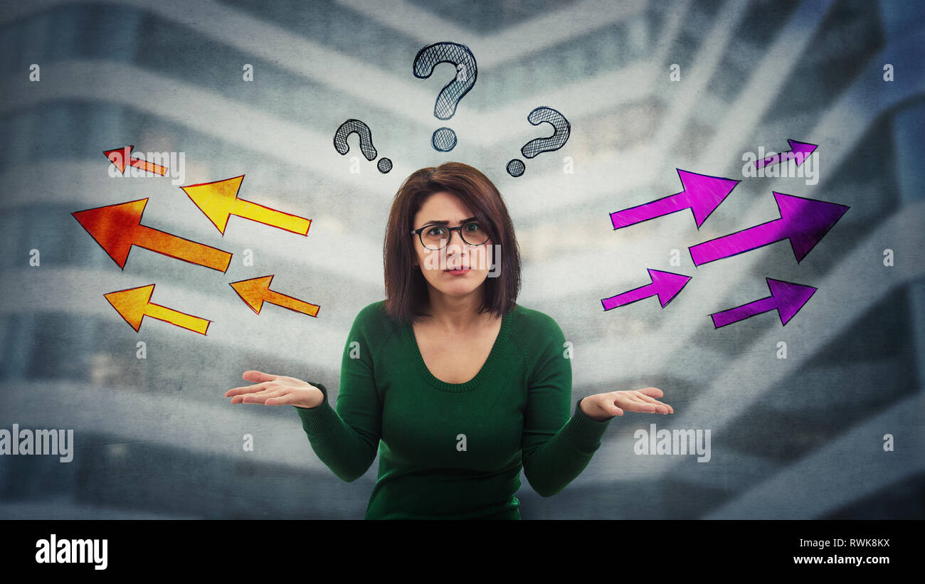 Perplexed woman with puzzled face confused and frustrated has to choose ...