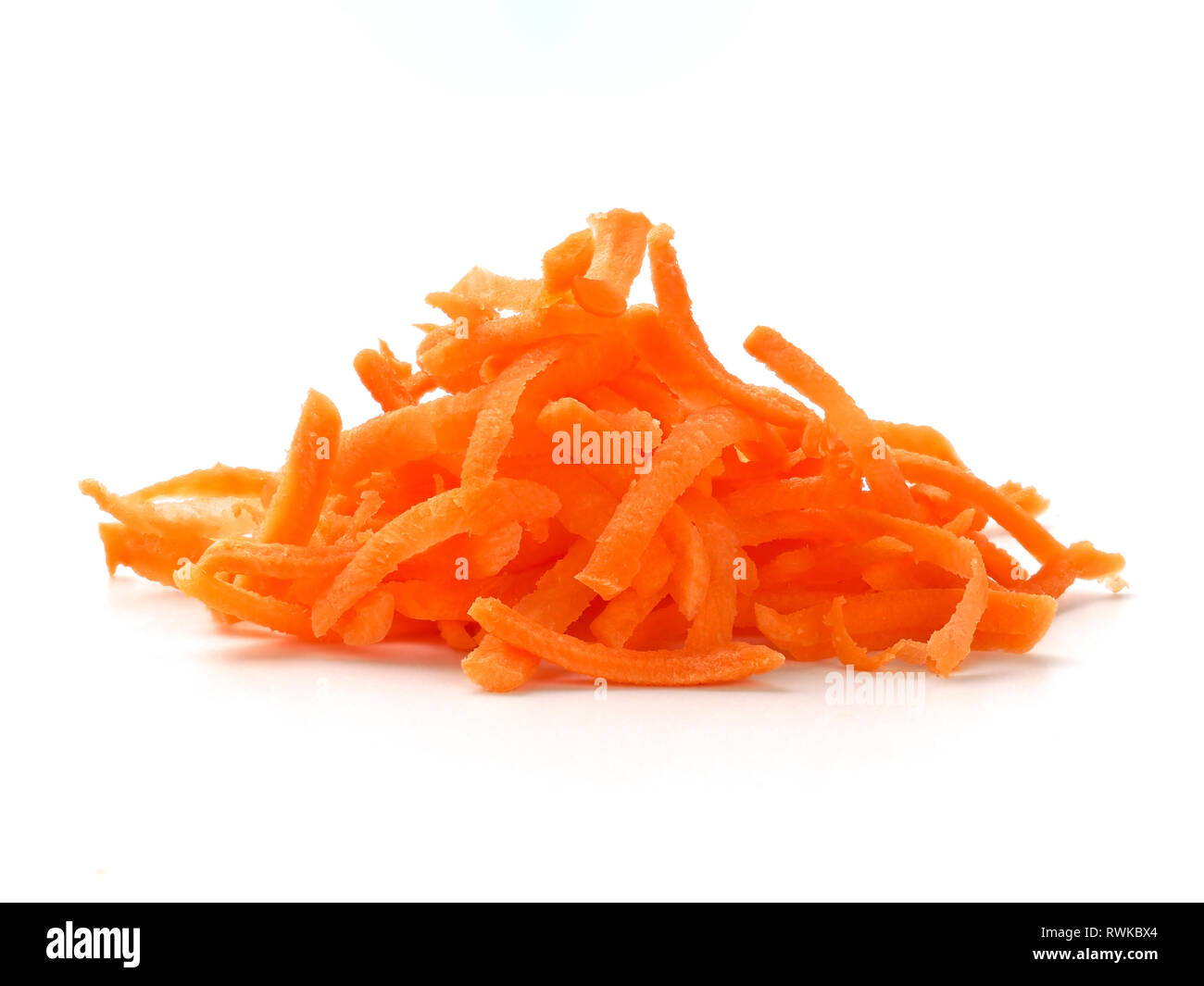 Pile of fresh organic shredded carrots. Raw grated carrots isolated on ...