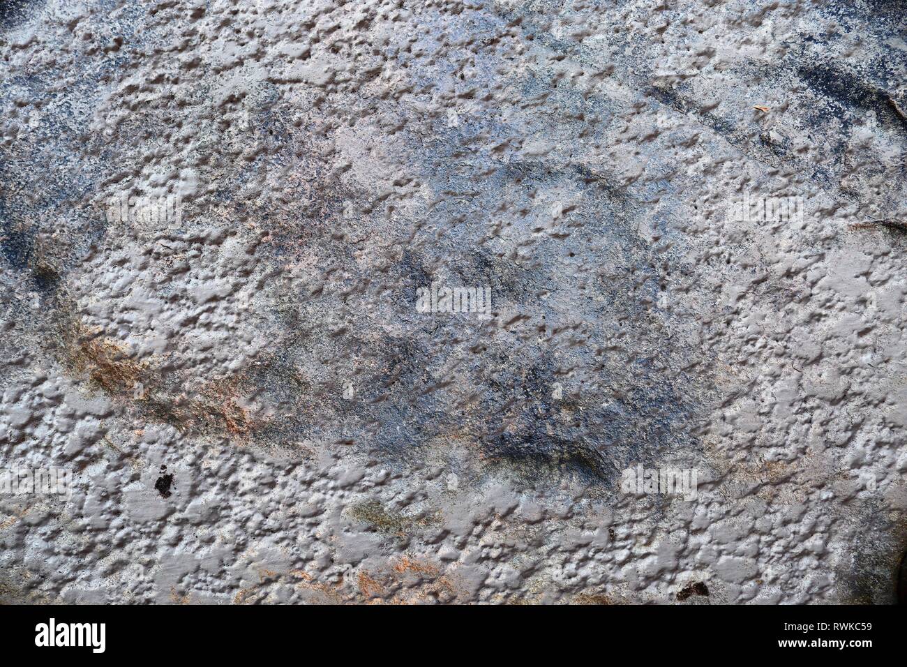 Close up detailed surface of granite and concrete mixed walls in high ...