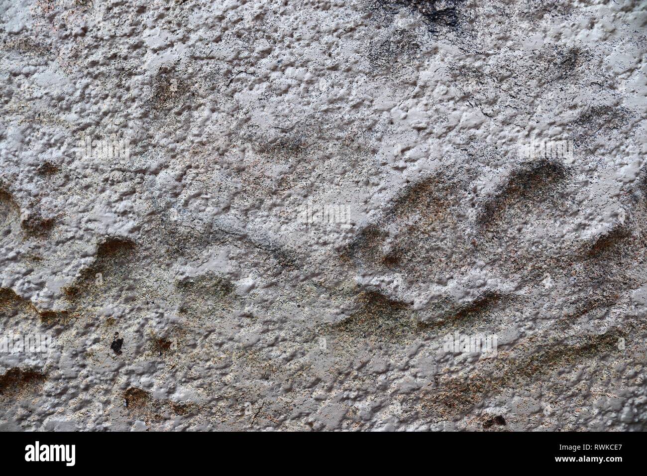 Close up detailed surface of granite and concrete mixed walls in high ...