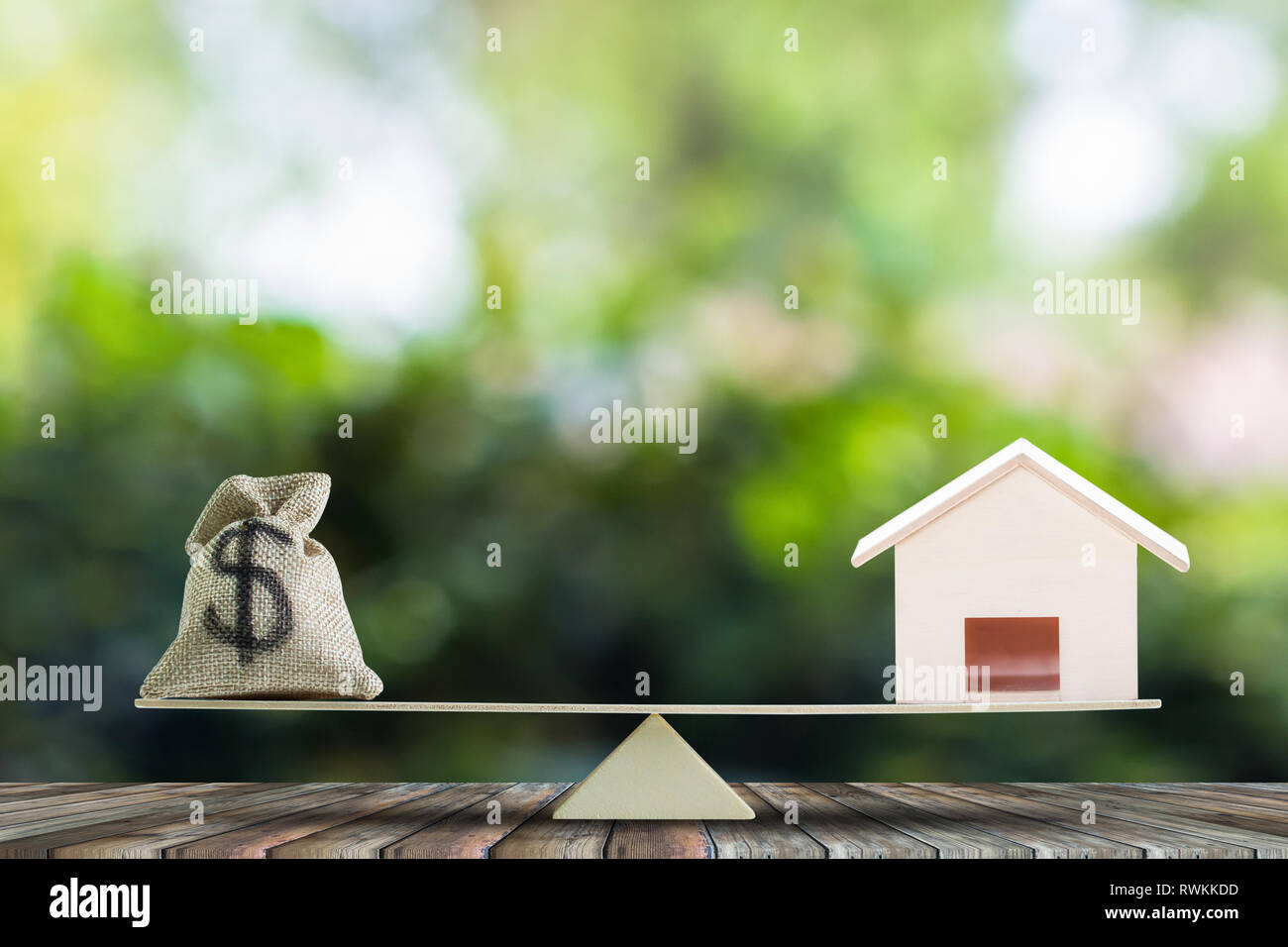 Concept scales money house hi-res stock photography and images - Alamy