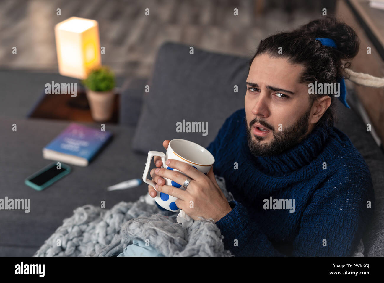 Sad depressed man drinking tea hi-res stock photography and images - Alamy