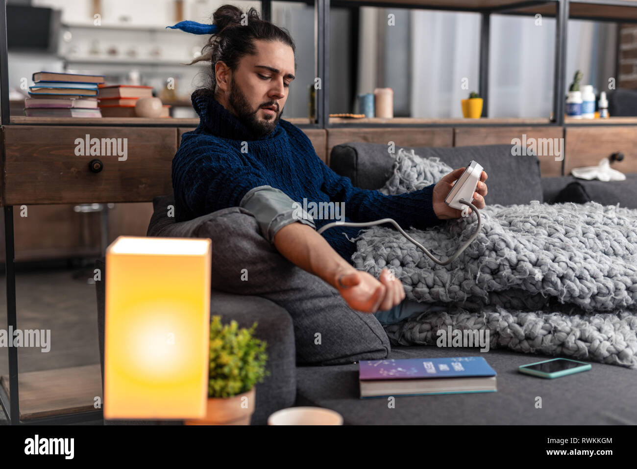 Nice serious man stretching out his hand Stock Photo - Alamy
