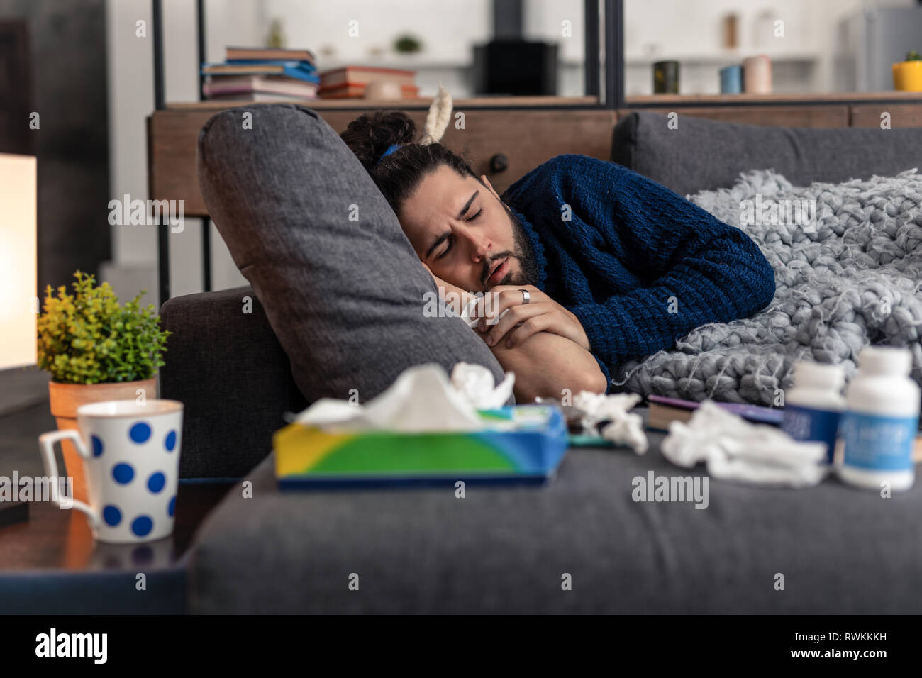 Falling asleep on sofa hi-res stock photography and images - Alamy