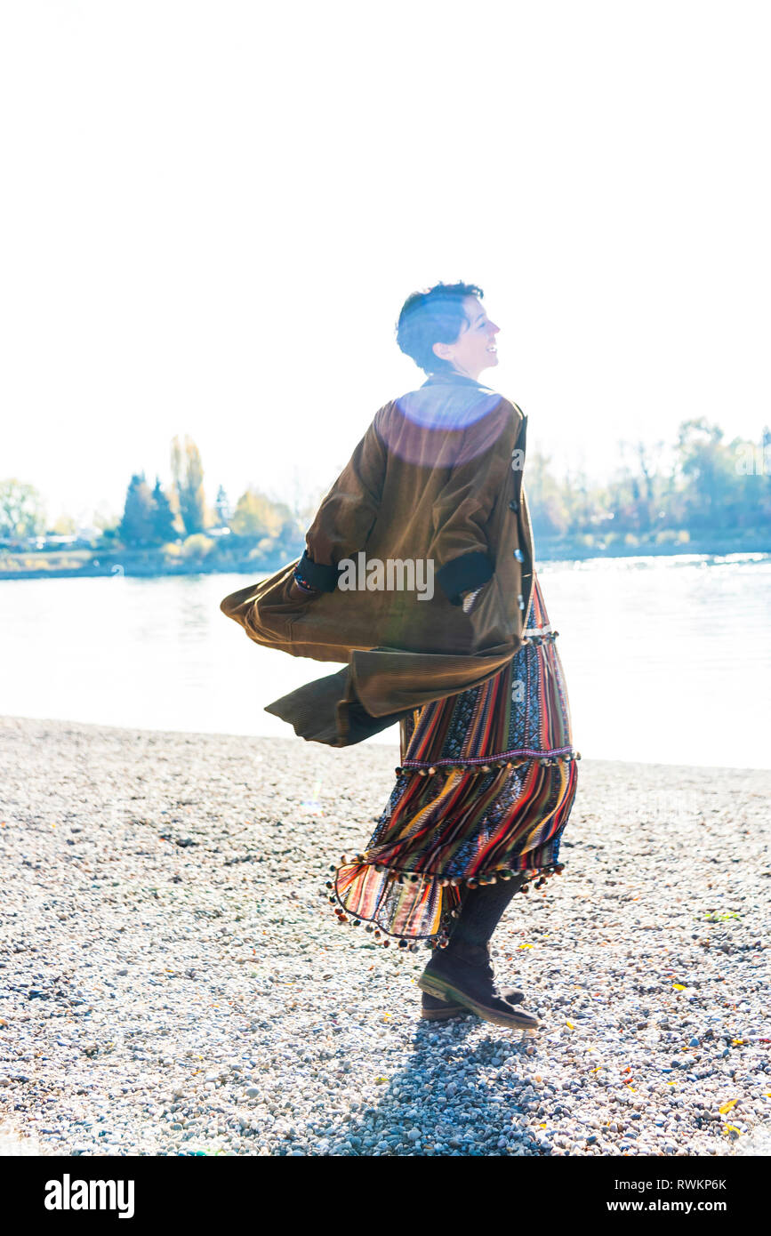 Woman twirling by Rhine River, Strandbad, Mannheim, Germany Stock Photo ...