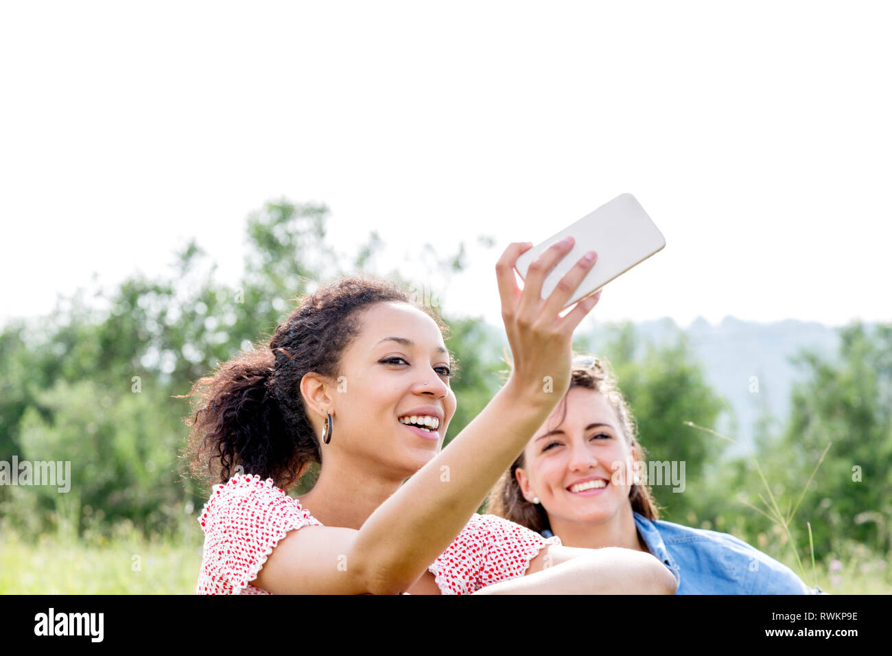 Friends taking selfie Stock Photo - Alamy