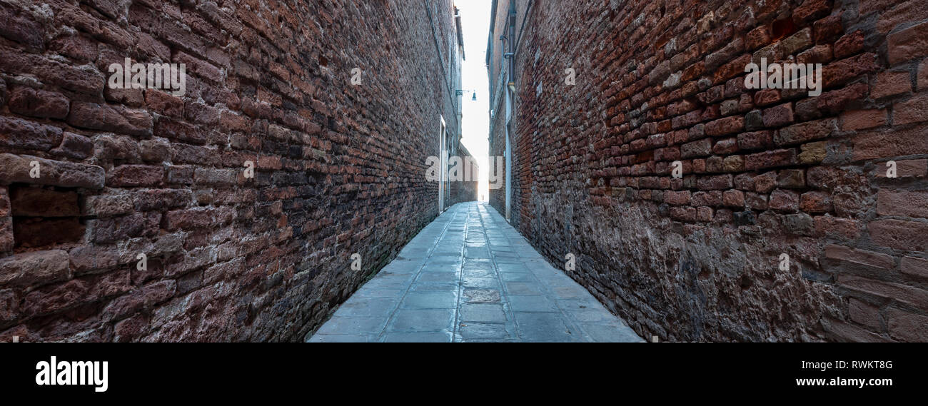 Venice Narrow Brick walled alley Stock Photo - Alamy