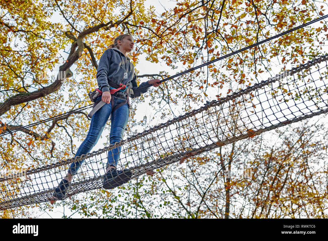 Girl on high rope course, Paris, Ile-de-France, France Stock Photo - Alamy