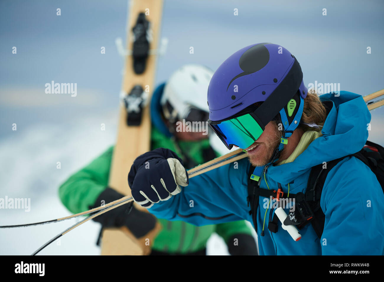 Male skier carrying skis hi-res stock photography and images - Alamy