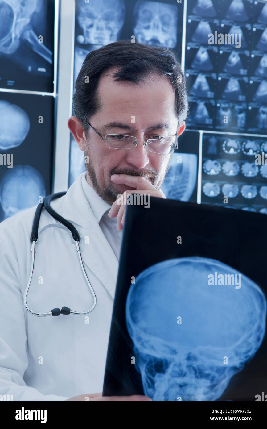 Doctor examining Xray image Stock Photo - Alamy