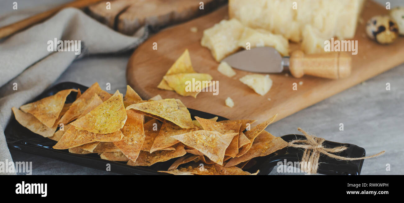 Homemade crispy chips with parmesan cheese made of Armenian flat bread ...