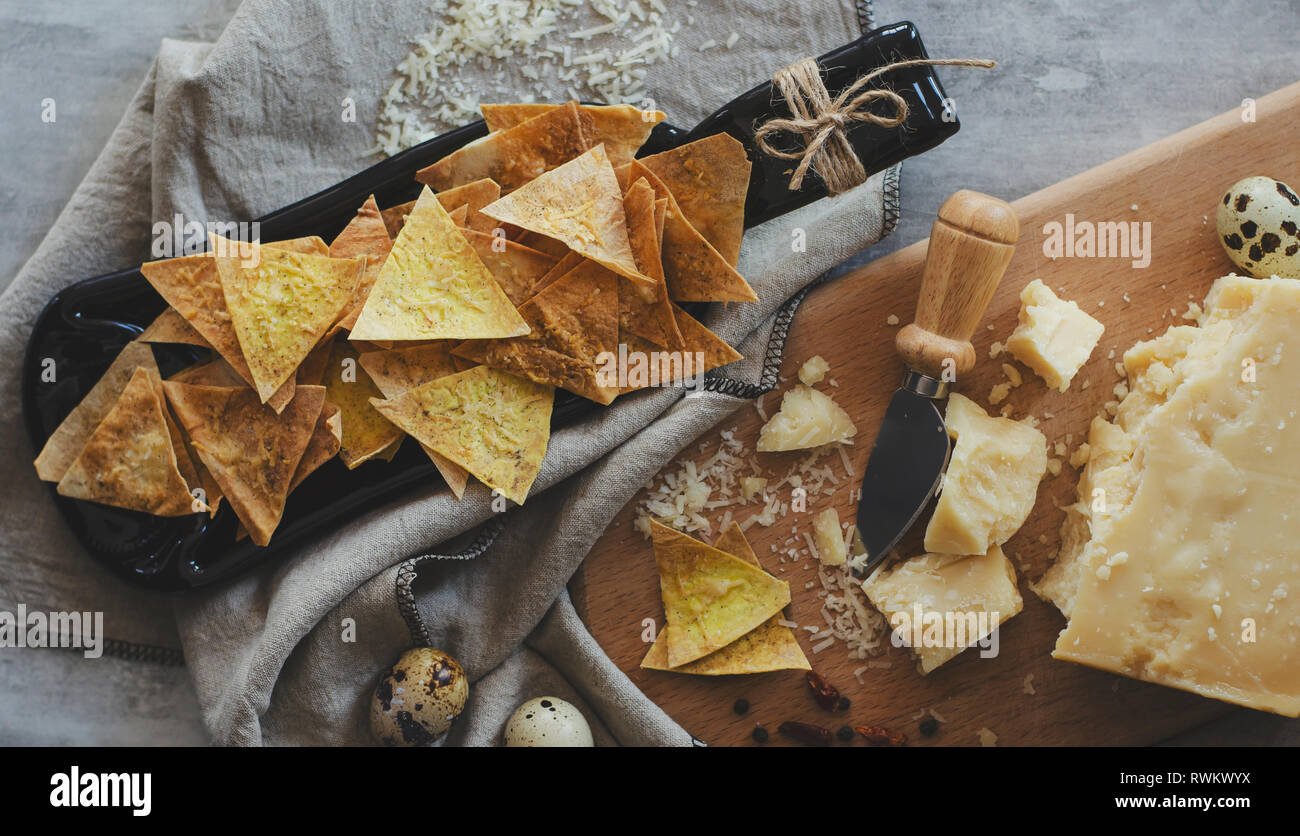 Homemade crispy chips with parmesan cheese made of Armenian flat bread ...