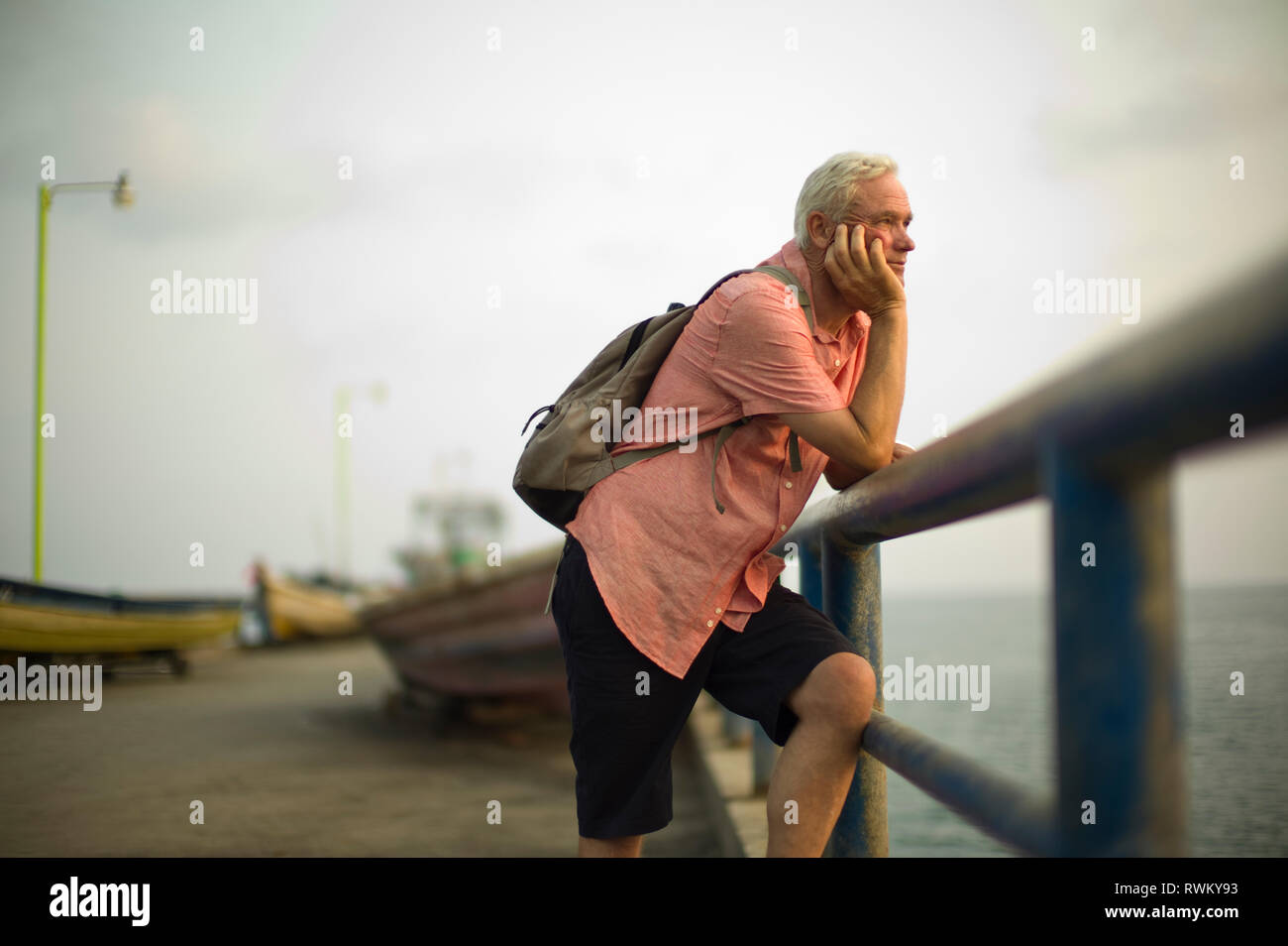 Man leaning on hand rail hi-res stock photography and images - Alamy