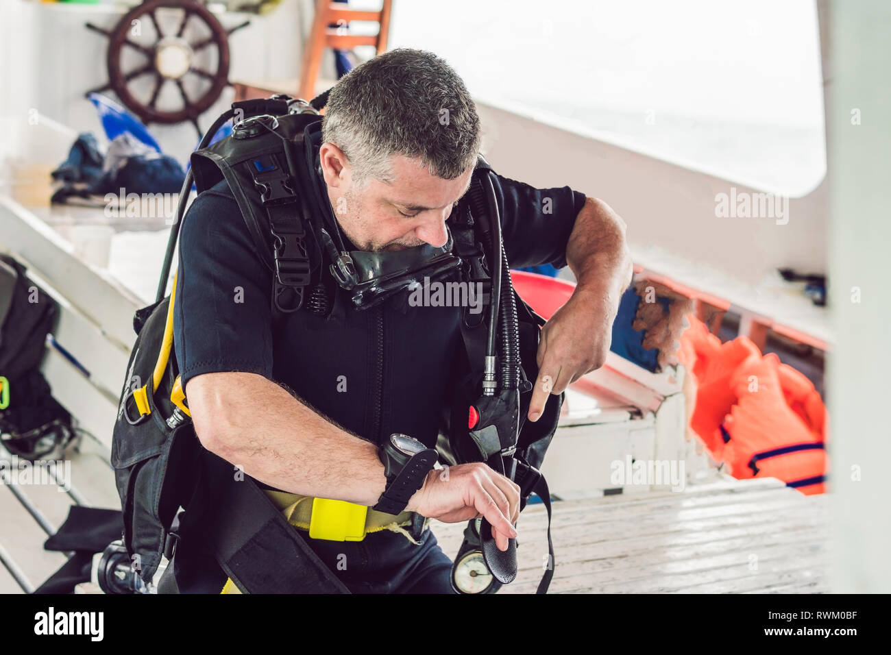 Diver prepares his equipment for diving in the sea Stock Photo - Alamy