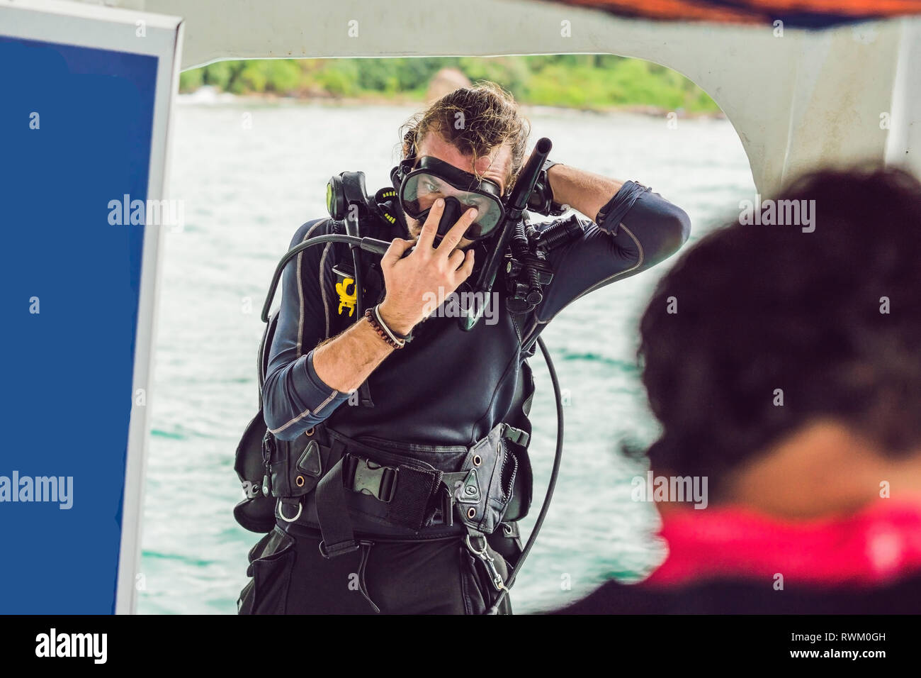 Diver preparing to dive into the sea Stock Photo - Alamy