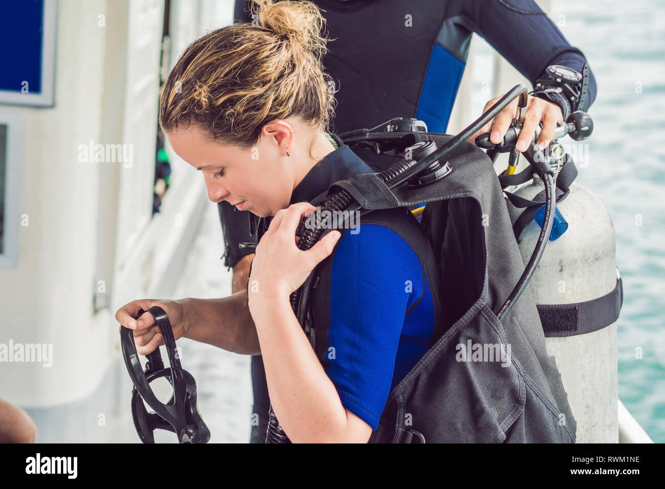 Woman Preparing For Scuba Diving High Resolution Stock Photography and ...