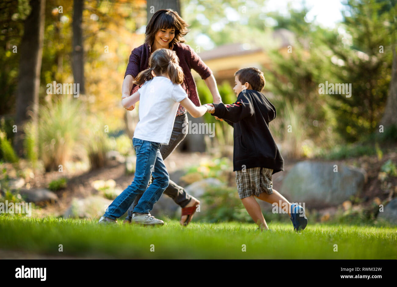 Mother dancing with her young children Stock Photo - Alamy