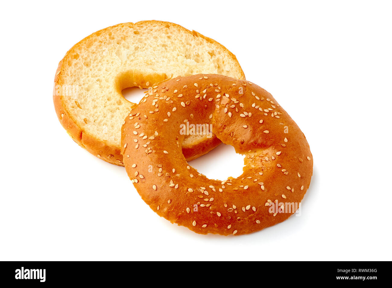 Fresh and sliced bagel on white background Stock Photo - Alamy
