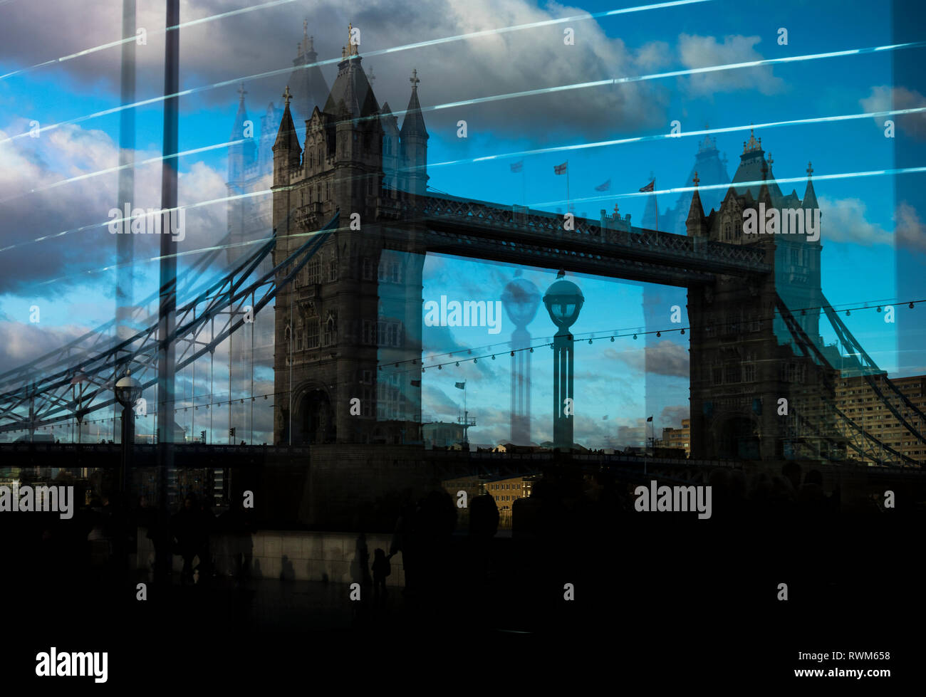 Reflection of Tower Bridge on glass building on south bank of river ...