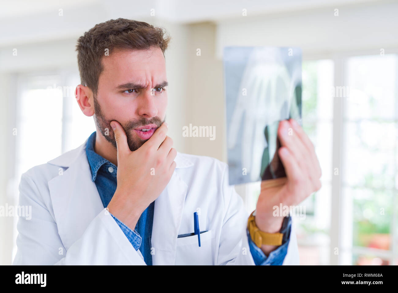 Doctor man looking at x-ray radiography doing body examination Stock ...