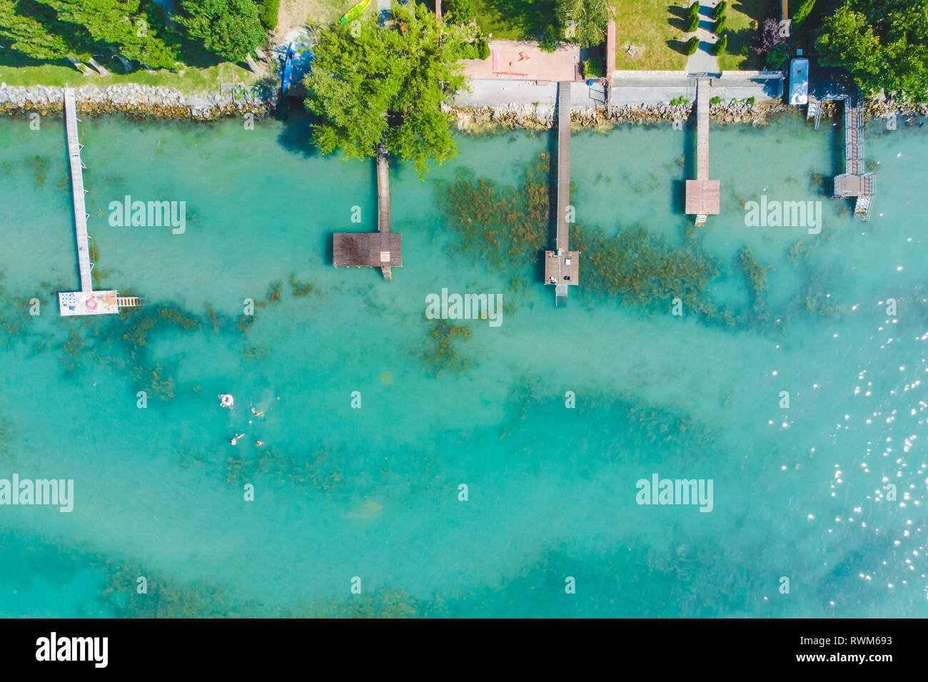 aerial view of the shore with building. back yards with piers. overhead ...