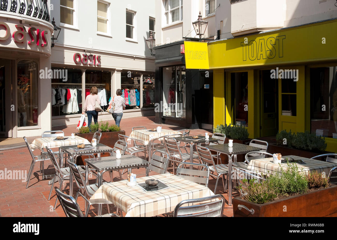Empty tables and chairs outside a cafe in the coastal town of Brighton ...