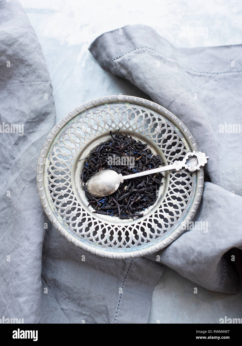 Fresh tea leaves in silver plate Stock Photo - Alamy