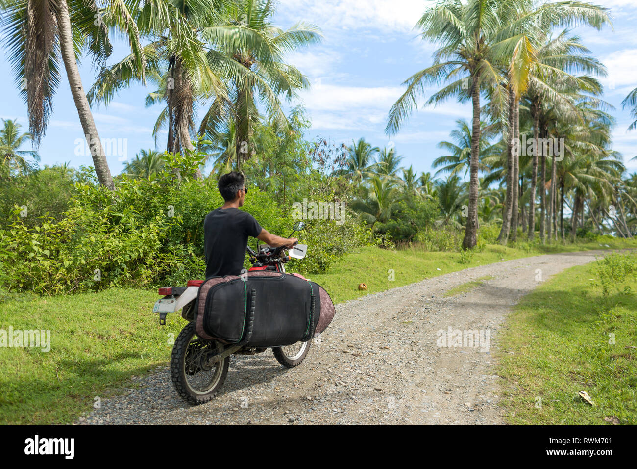 Motorcyclist with surfboard, Abulug, Cagayan, Philippines Stock Photo ...