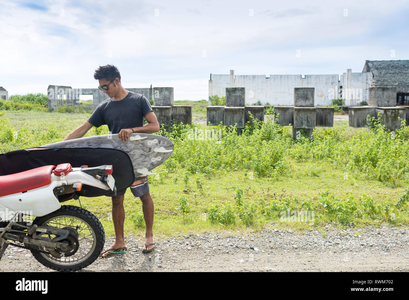 Motorcyclist with surfboard, Abulug, Cagayan, Philippines Stock Photo ...