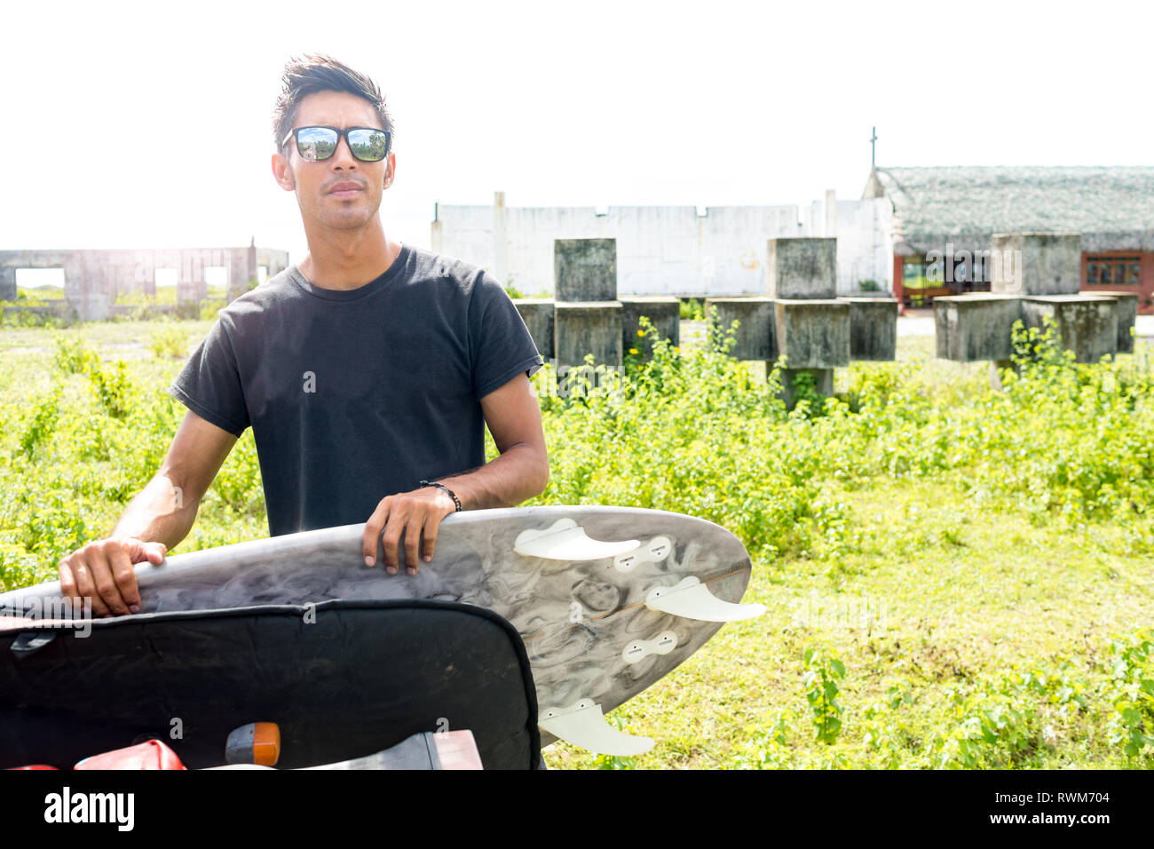 Man with surfboard, Abulug, Cagayan, Philippines Stock Photo - Alamy