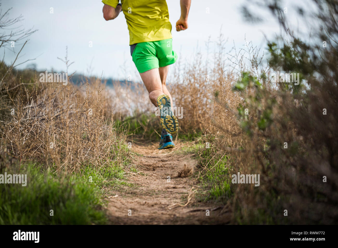 Man running cliff hi-res stock photography and images - Alamy