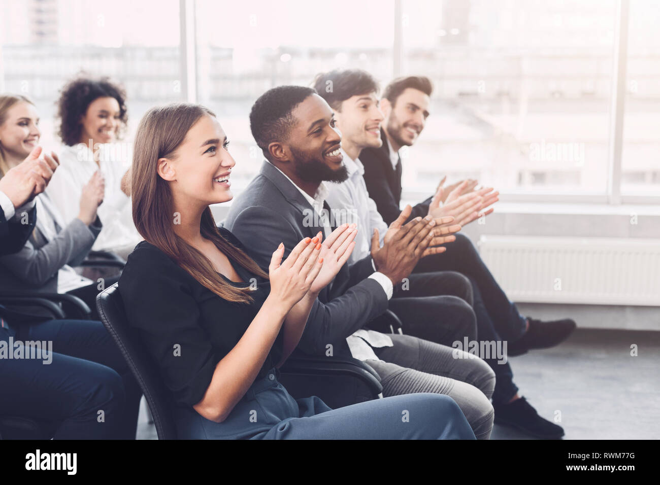 Business education. Colleagues clapping hands at seminar Stock Photo ...