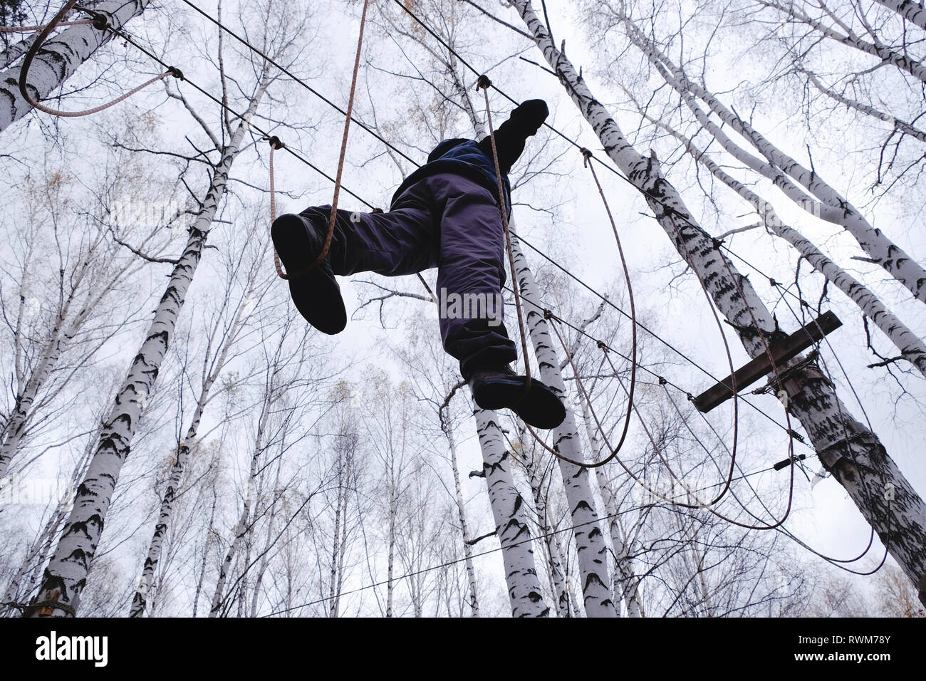 Man walking on rope bridge, Ural, Sverdlovsk, Russia Stock Photo - Alamy
