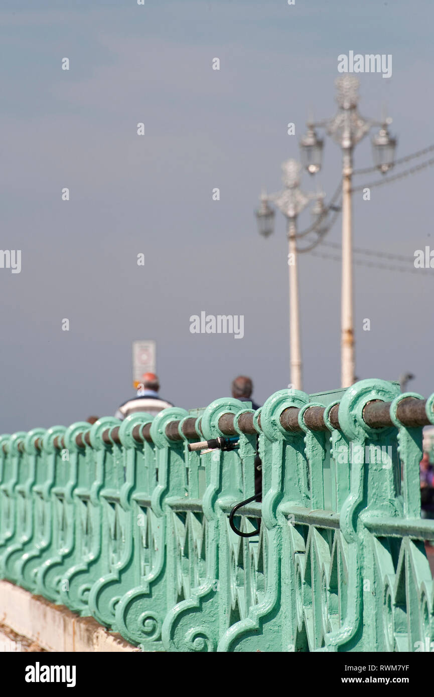 Metal railings on the seafront in the coastal town of Brighton, Sussex ...
