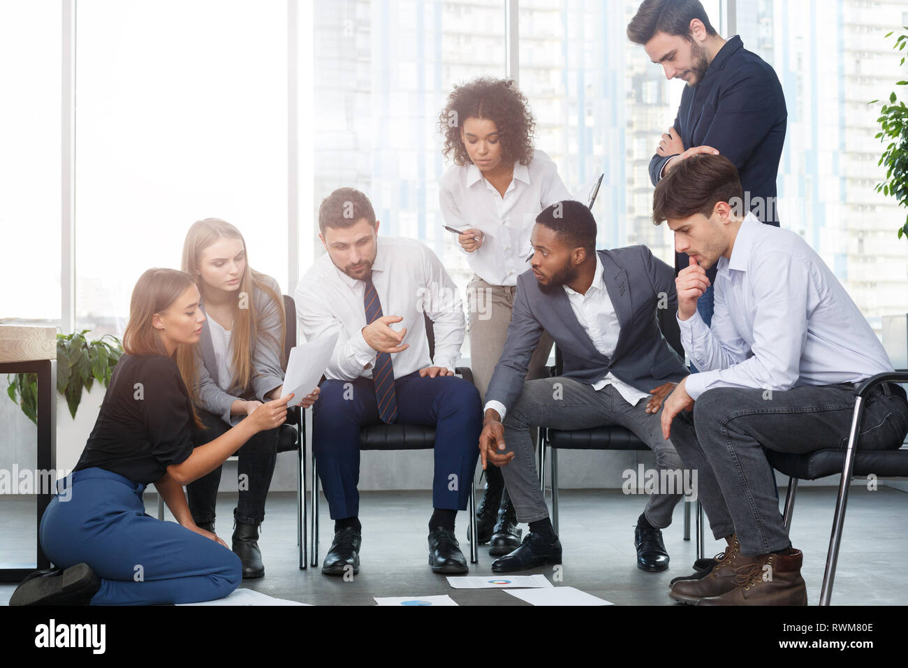 Multiethnic business team documents hi-res stock photography and images ...