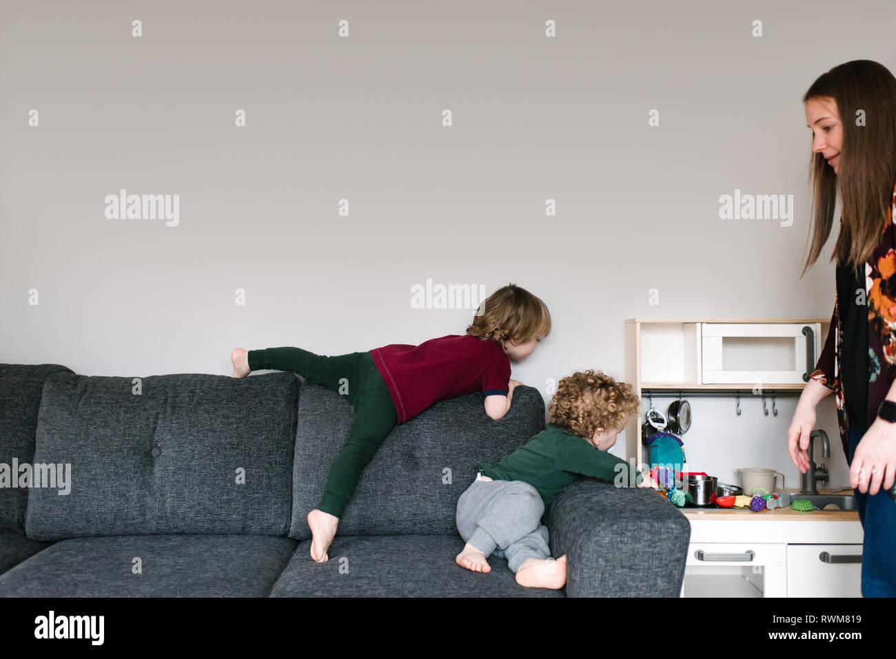 Children sofa watching parent hi-res stock photography and images - Alamy