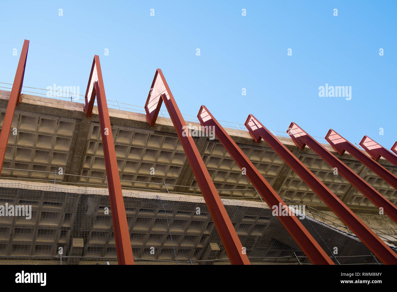 Unfinished high rise building with external girders Stock Photo - Alamy