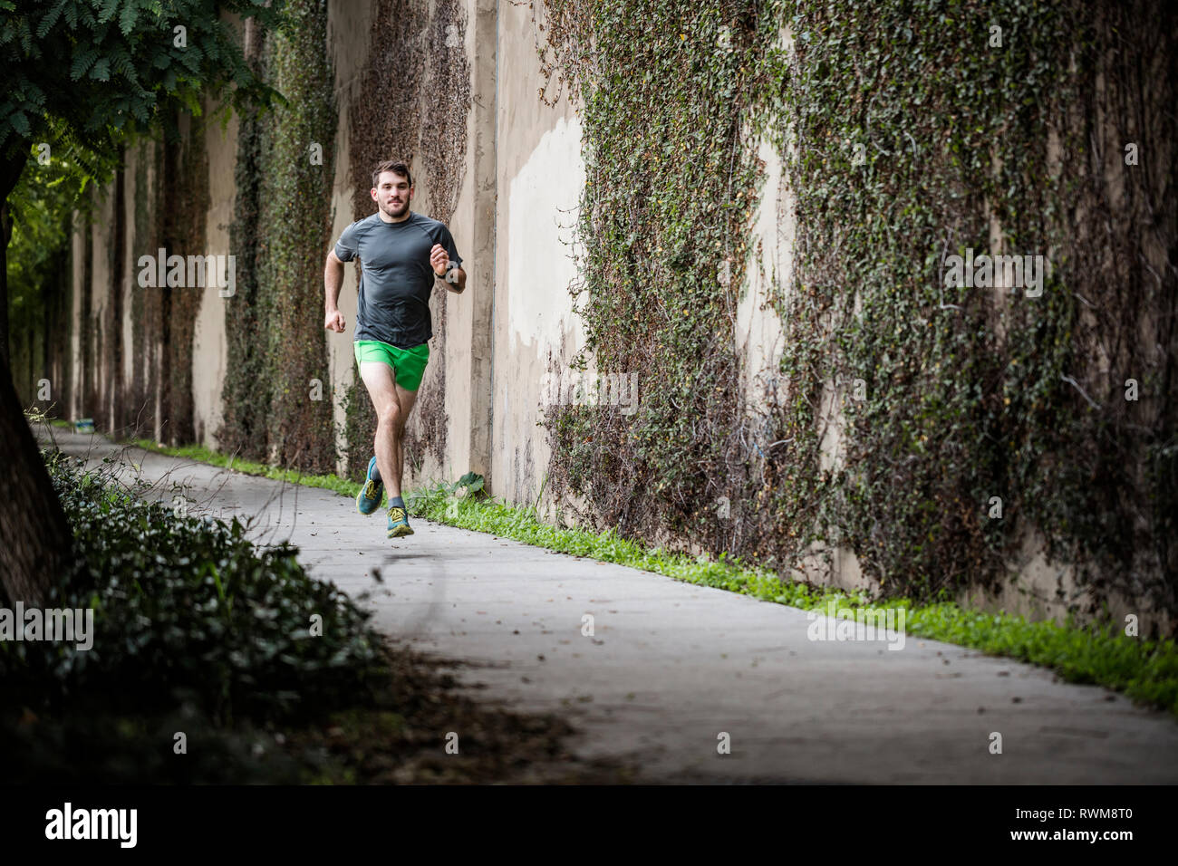 Young man running on urban hi-res stock photography and images - Alamy