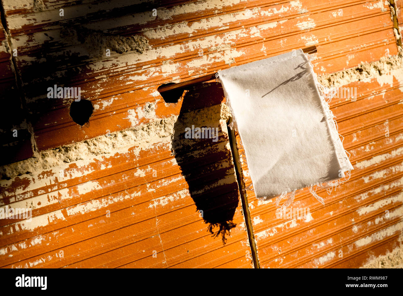 Ragged cloth being waved as a white flag Stock Photo - Alamy
